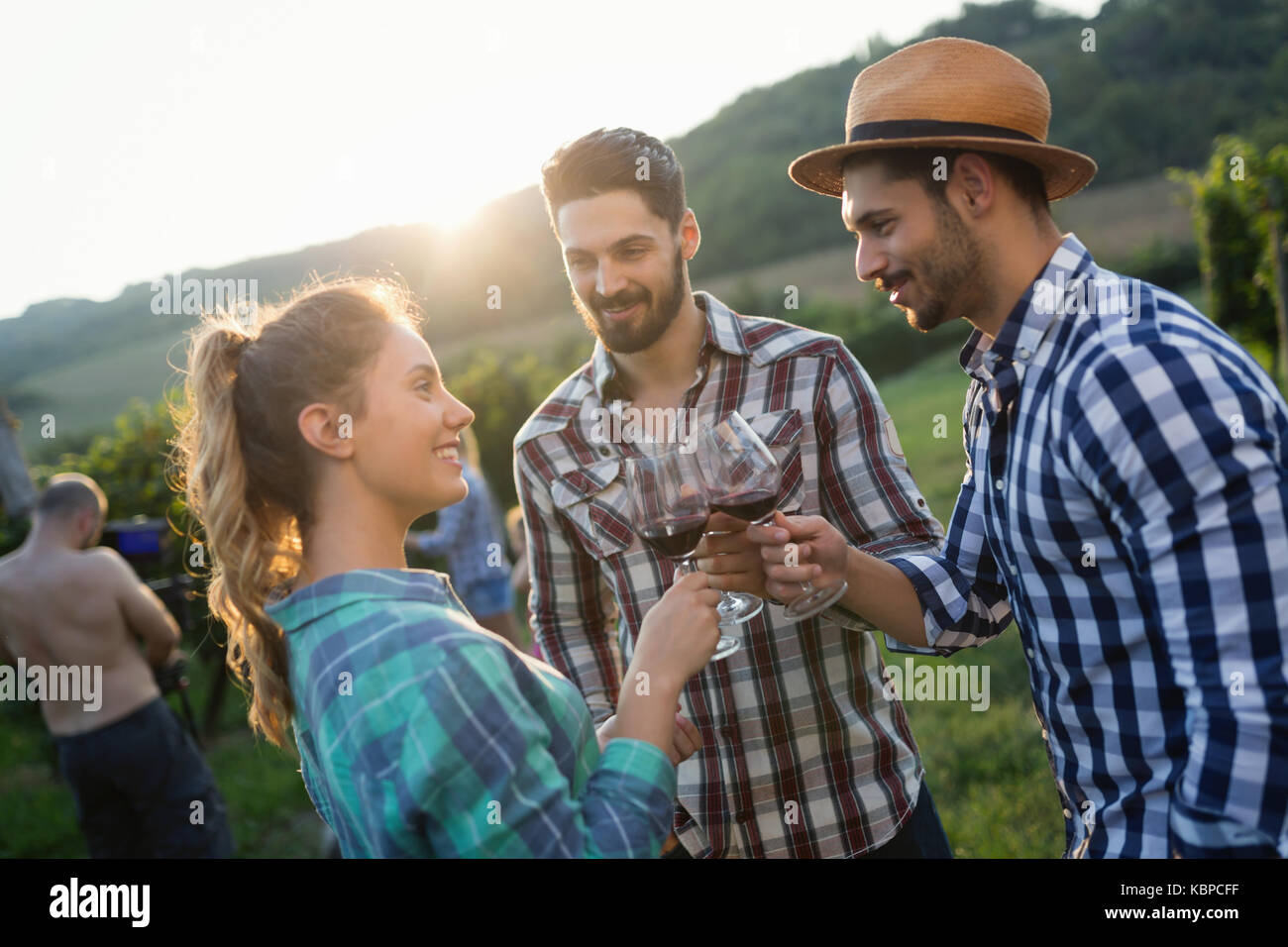 Wine grower and people in vineyard Stock Photo - Alamy