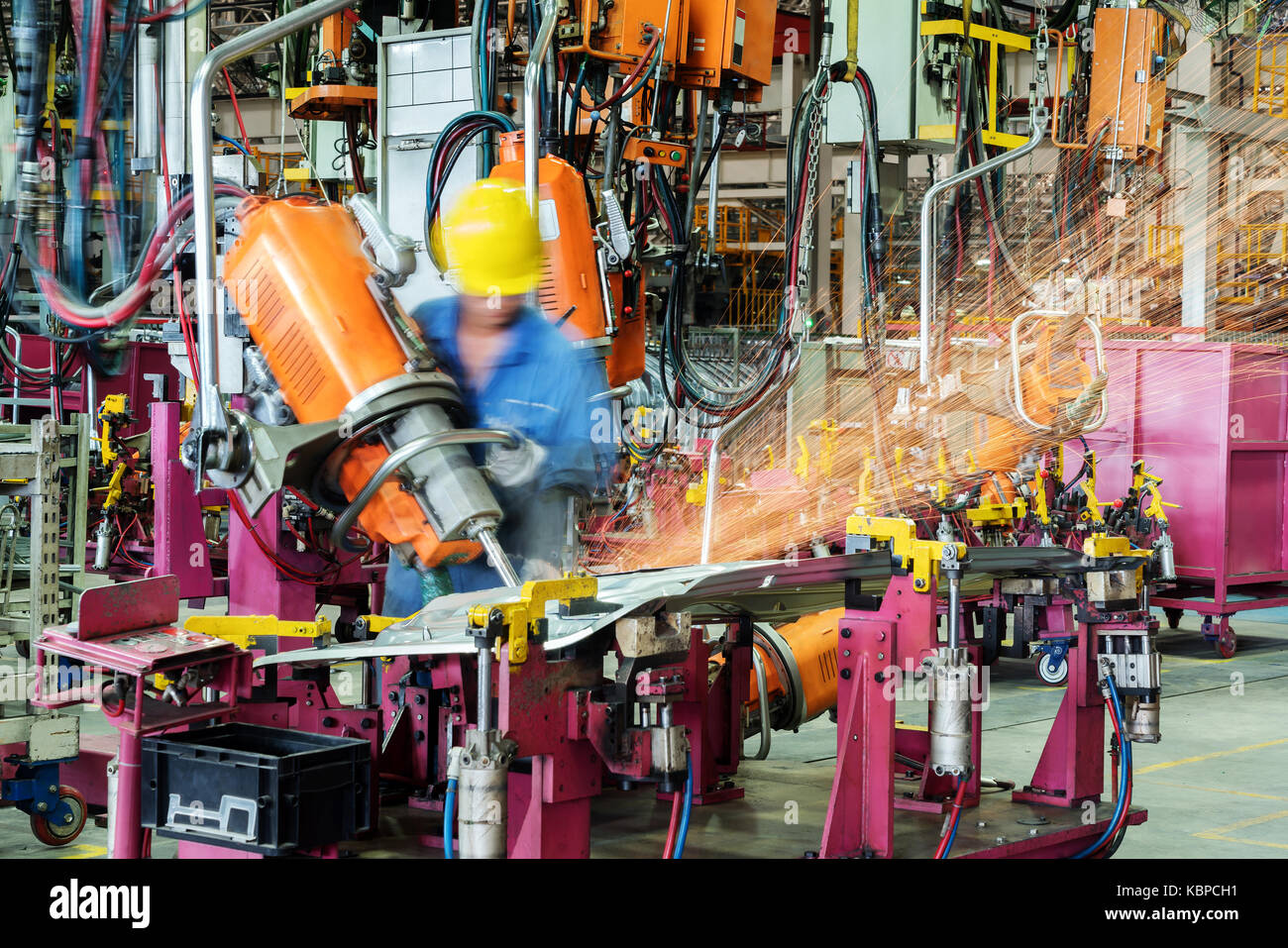 Car production line, skilled workers are working tense Stock Photo - Alamy