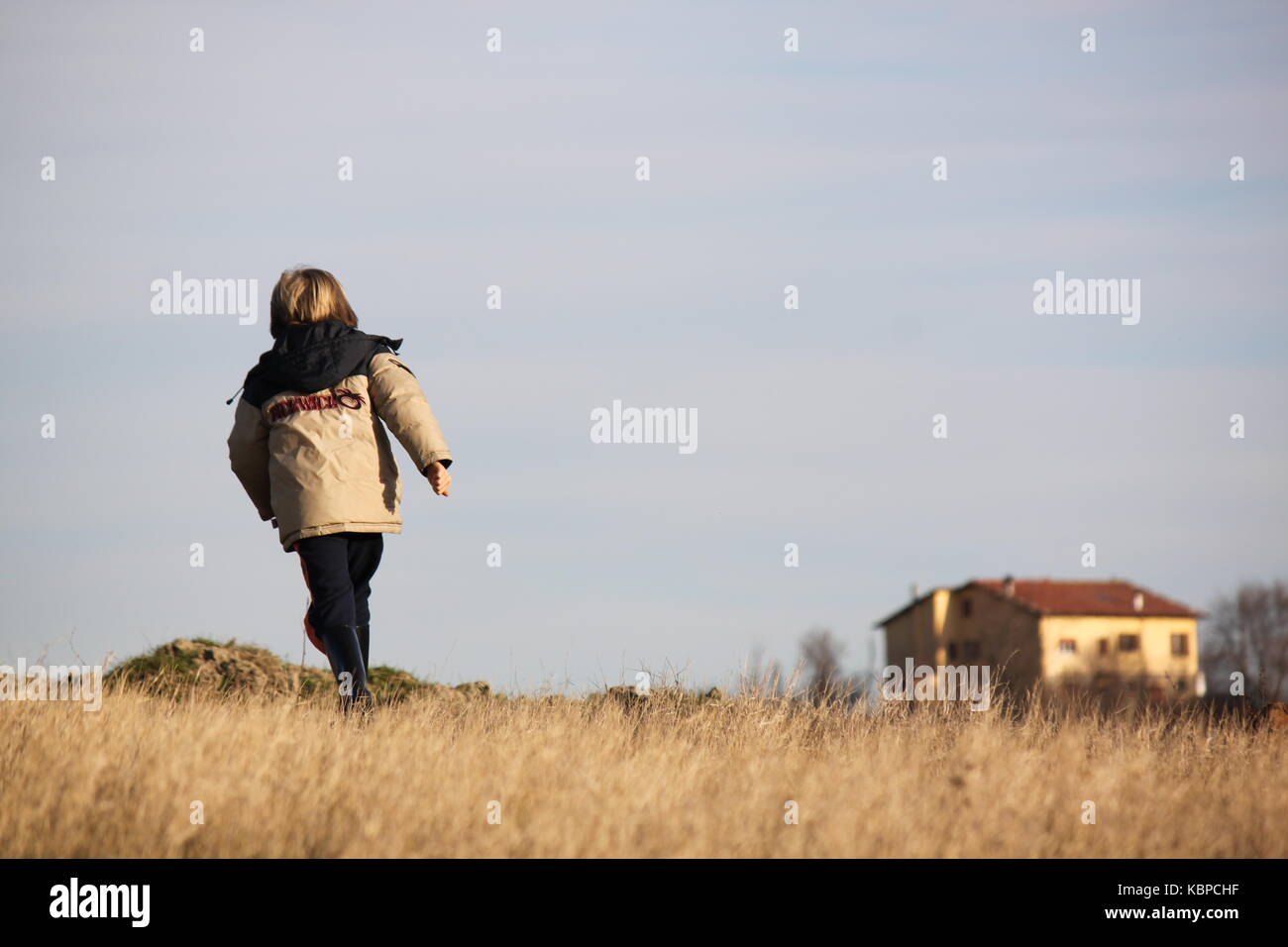 child running in a field in italian countryside Stock Photo - Alamy