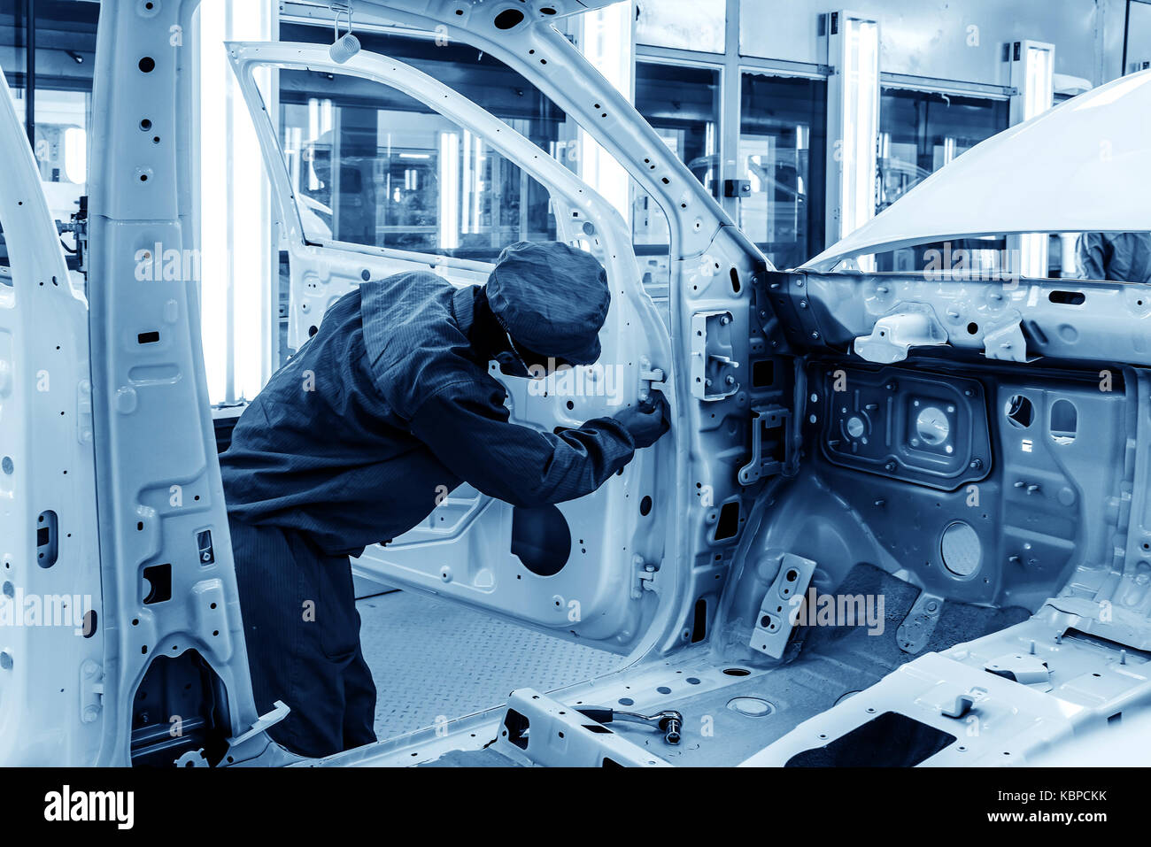Car production line, skilled workers are working tense Stock Photo - Alamy