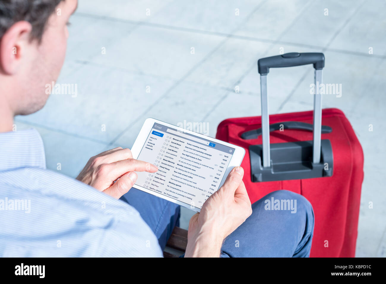 Businessman reading emails in inbox from contacts on digital tablet ...