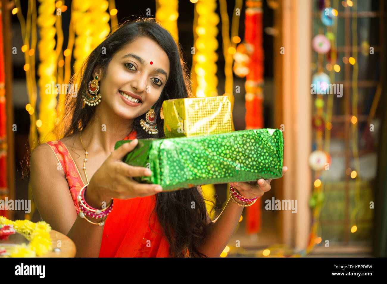 Indian woman smiling, celebration mood, indoor lighting Stock Photo - Alamy