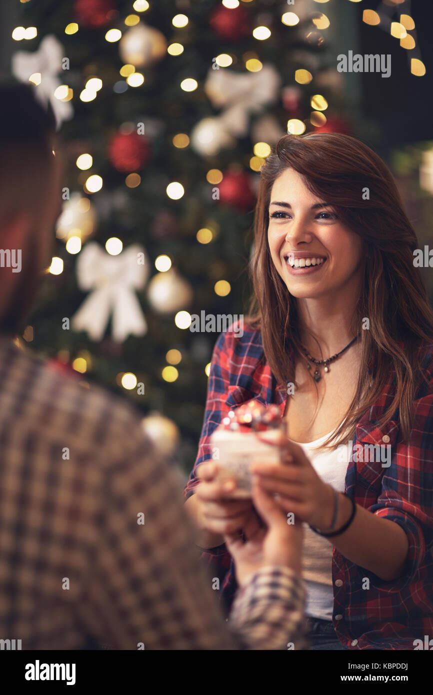 Man taking gift from woman hi-res stock photography and images - Alamy