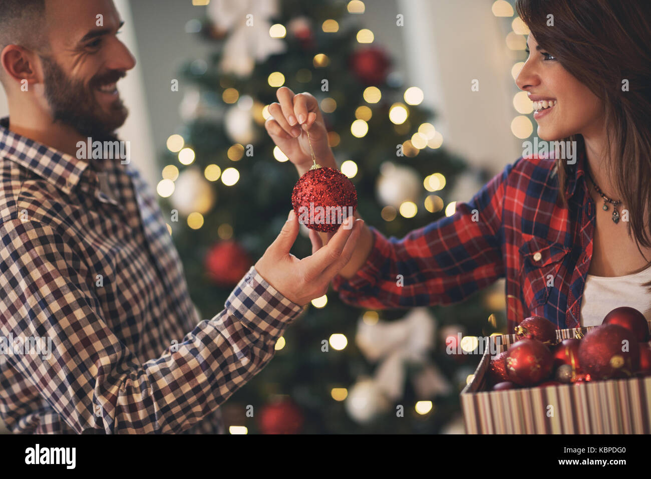 Couple together christmas tree hi-res stock photography and images - Alamy