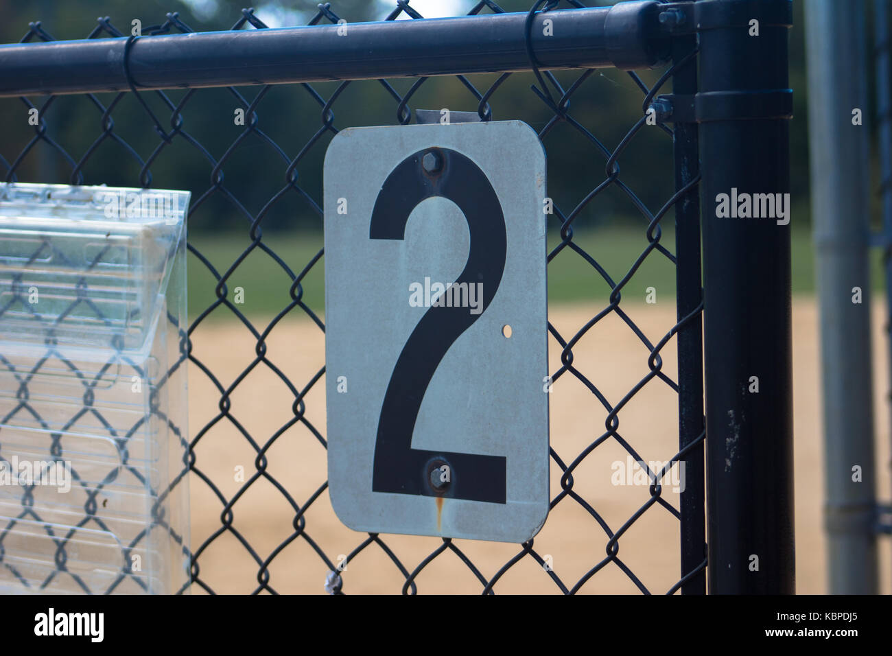 Number two on baseball fence Stock Photo - Alamy