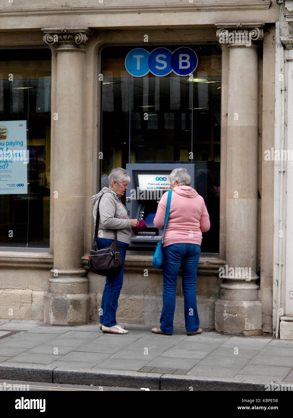 Two older ladies using a TSB ATM, Tewkesbury, Gloucestershire, UK Stock ...