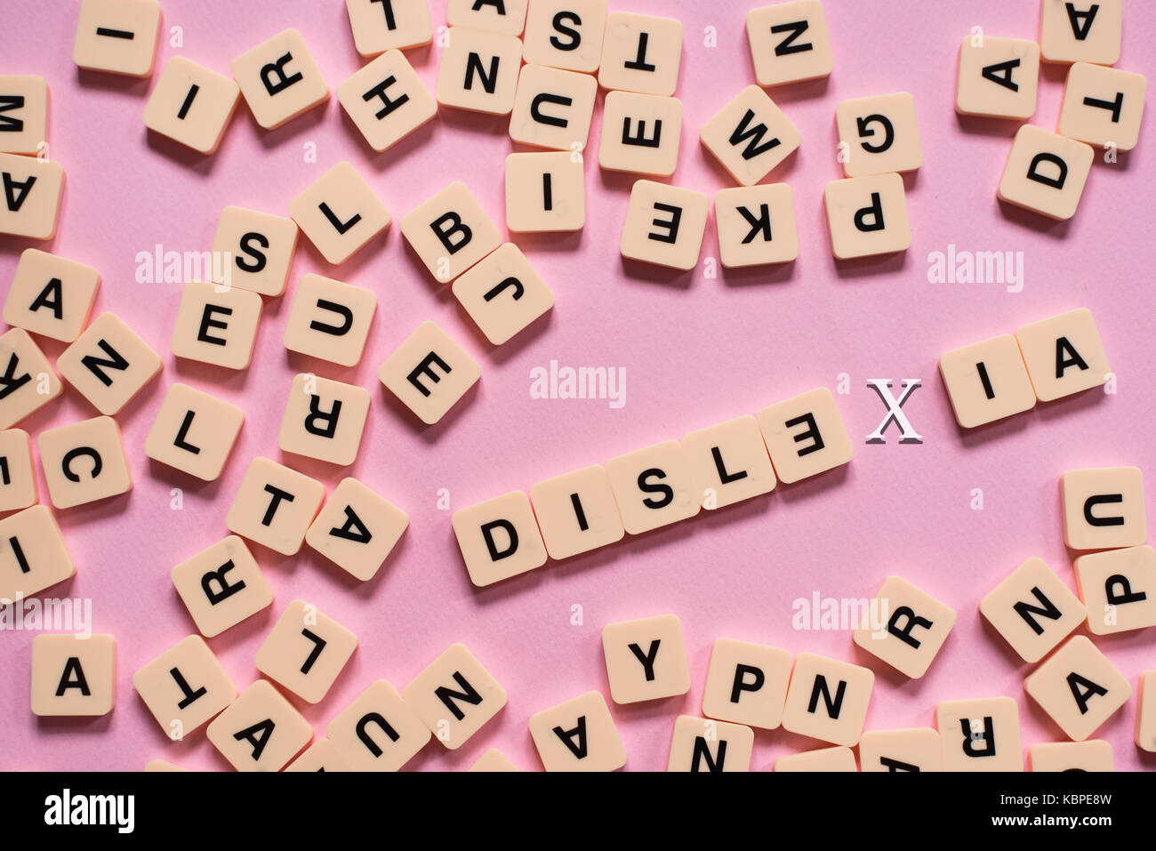 dyslexia concept - alphabet letters on pink background Stock Photo - Alamy