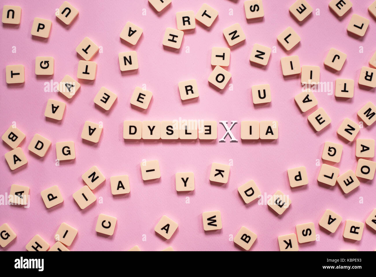 dyslexia concept - alphabet letters on pink background Stock Photo - Alamy