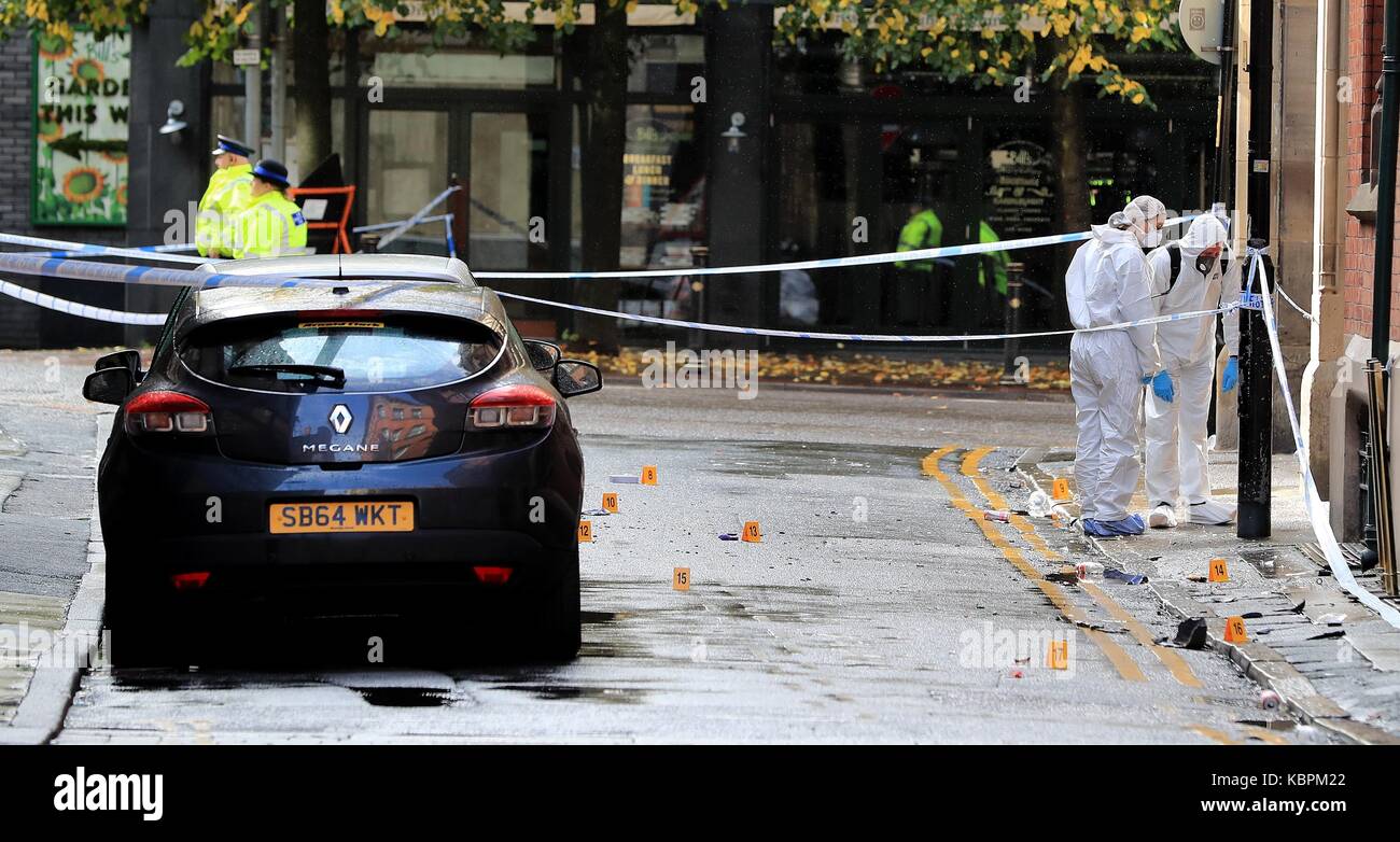 Forensic officers police at the scene in manchester city centre hi-res ...