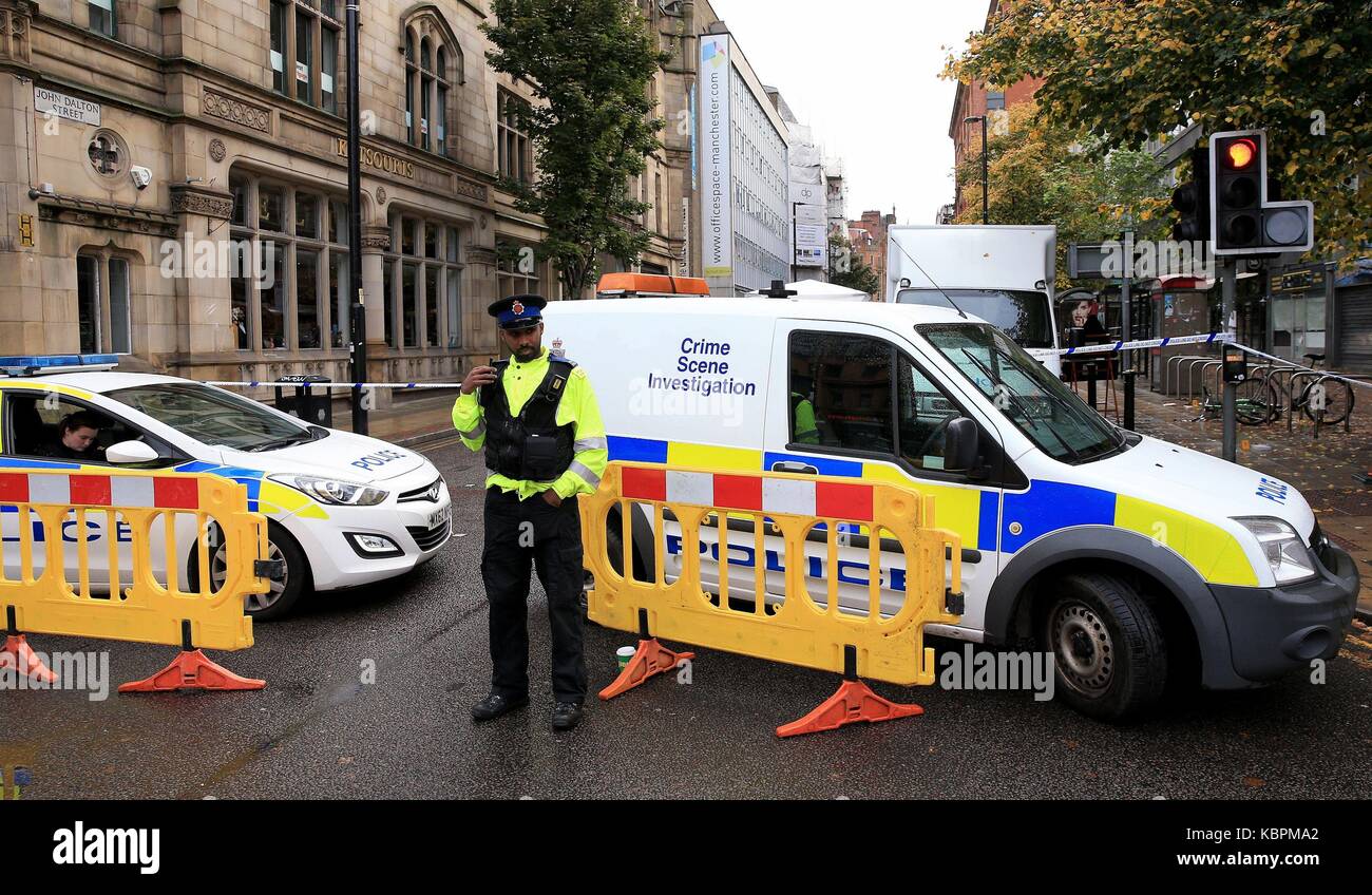 Forensic officers police at the scene in manchester city centre hi-res ...