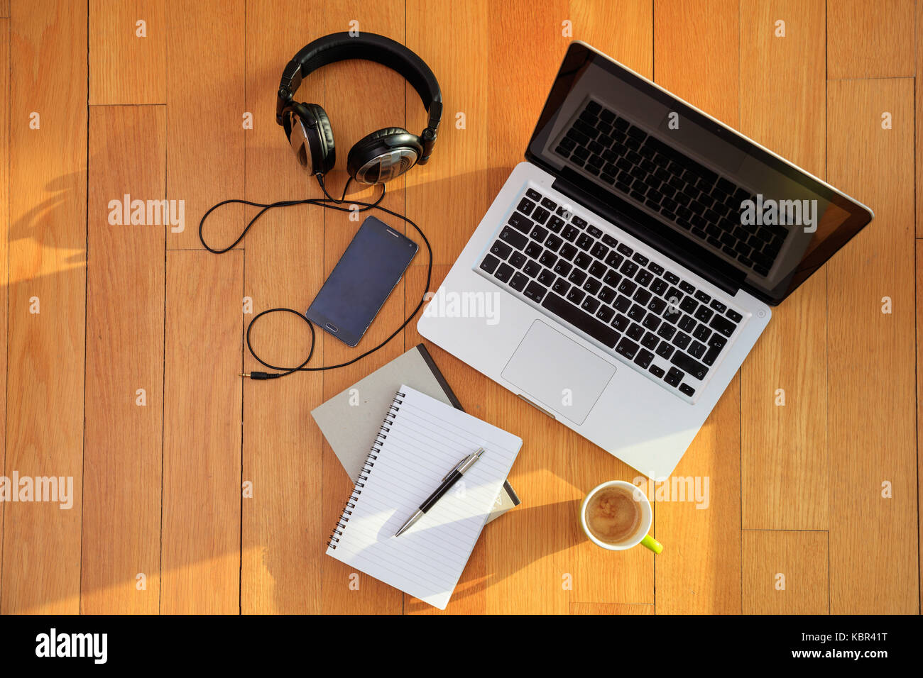 Modern workspace on the wooden floor, at home. Top view Stock Photo - Alamy