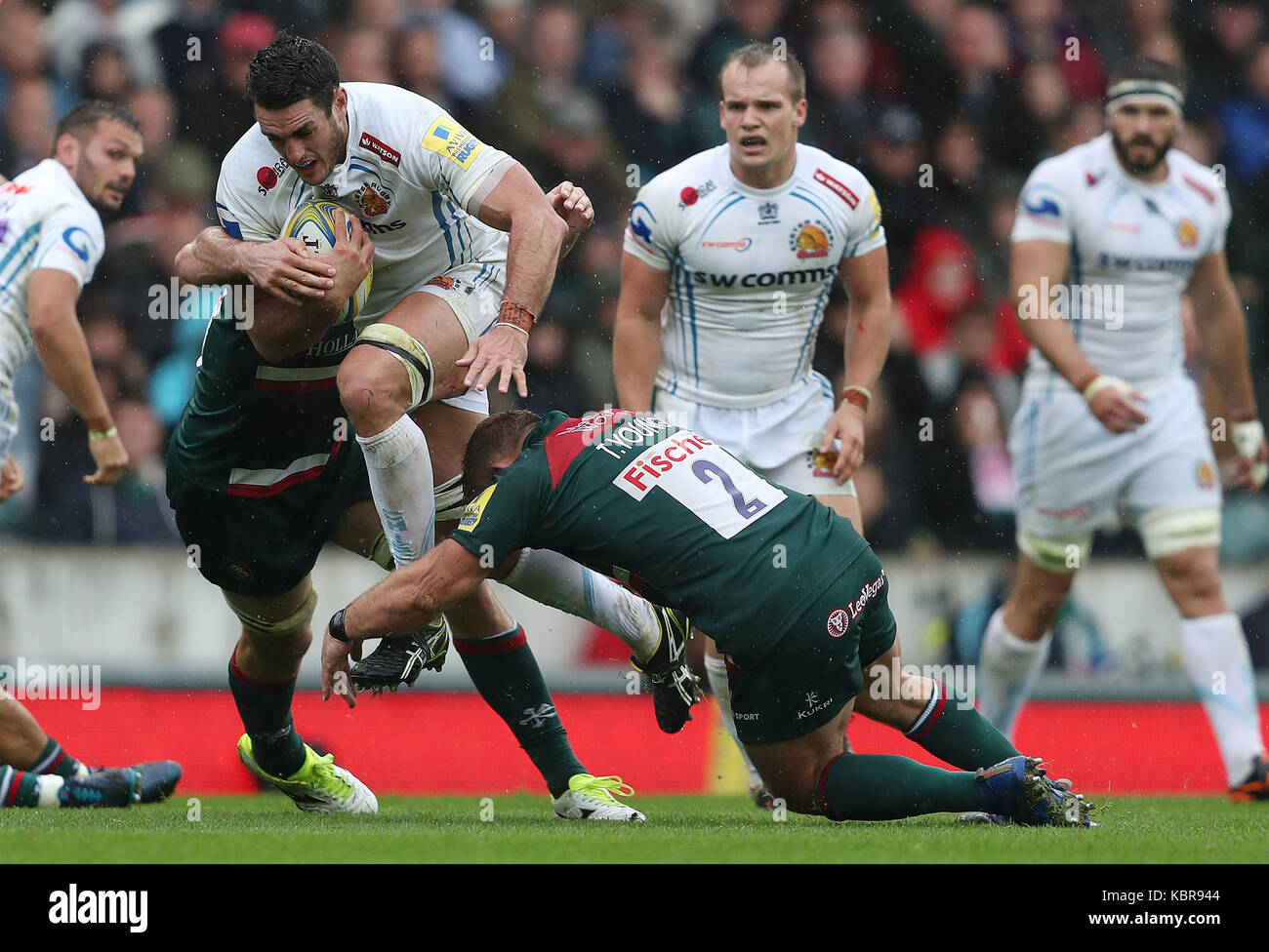 Exeter Chiefs Dave Dennis is tackled by Leicester Tigers Tom Youngs ...