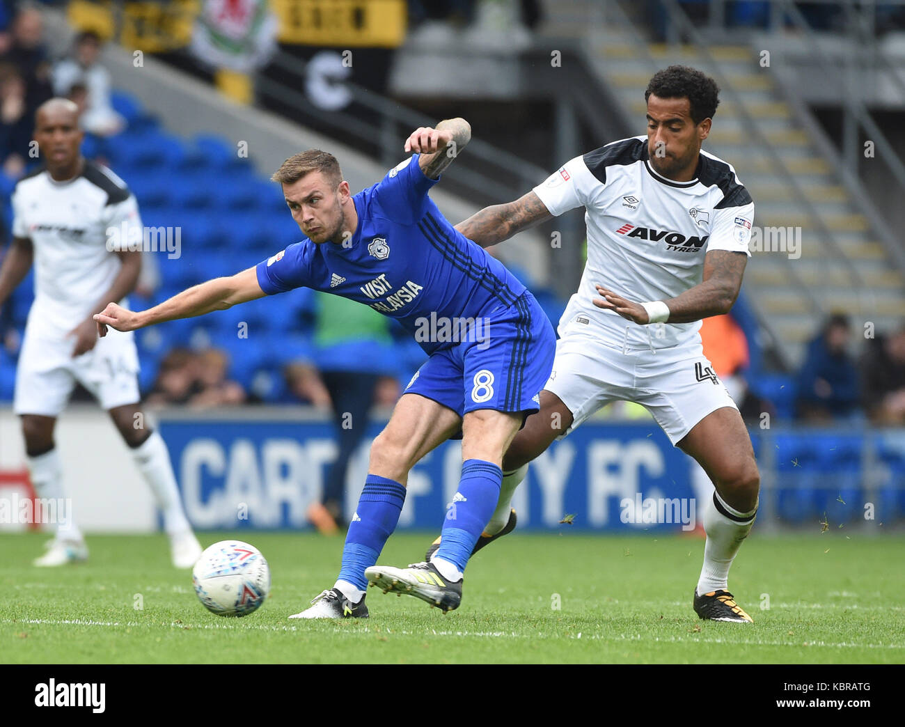 Cardiff City's Joe Ralls and Derby County's Tom Huddlestone (right) in ...