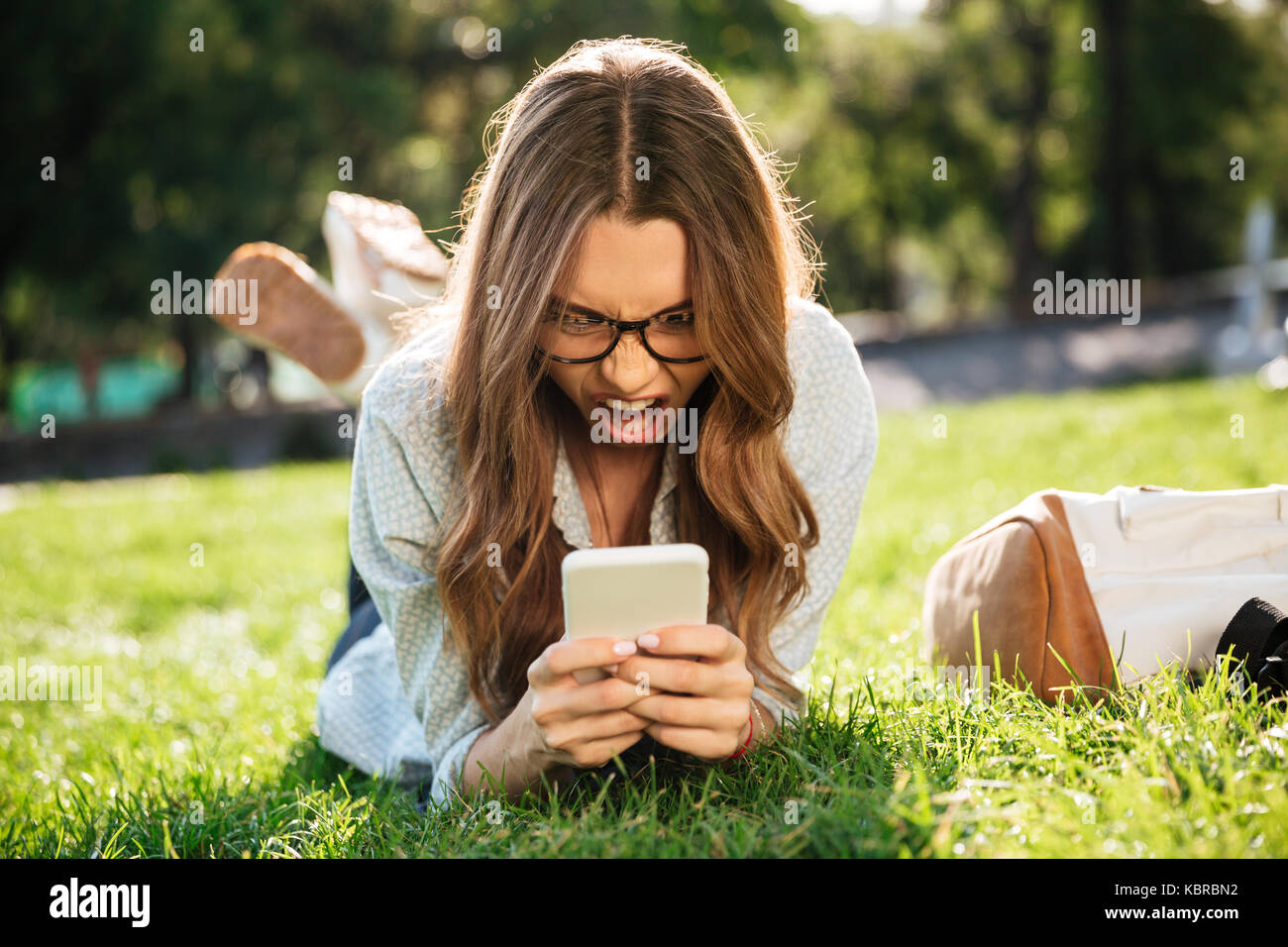 Girl screaming in grass hi-res stock photography and images - Alamy