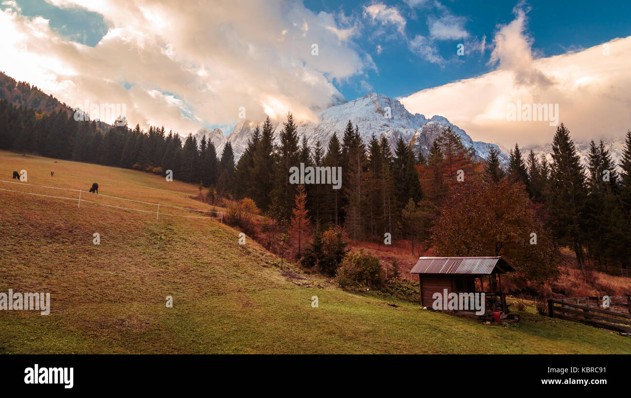 an alpine hut in the valley during a colorful sunrise Stock Photo - Alamy