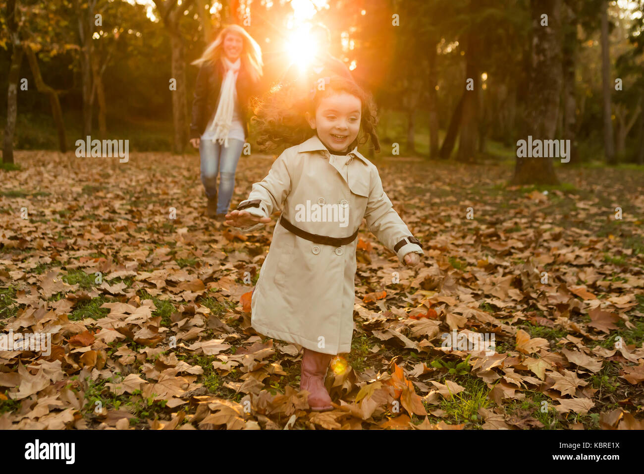 Outdoor portrait of a happy family enjoying the fall season Stock Photo ...