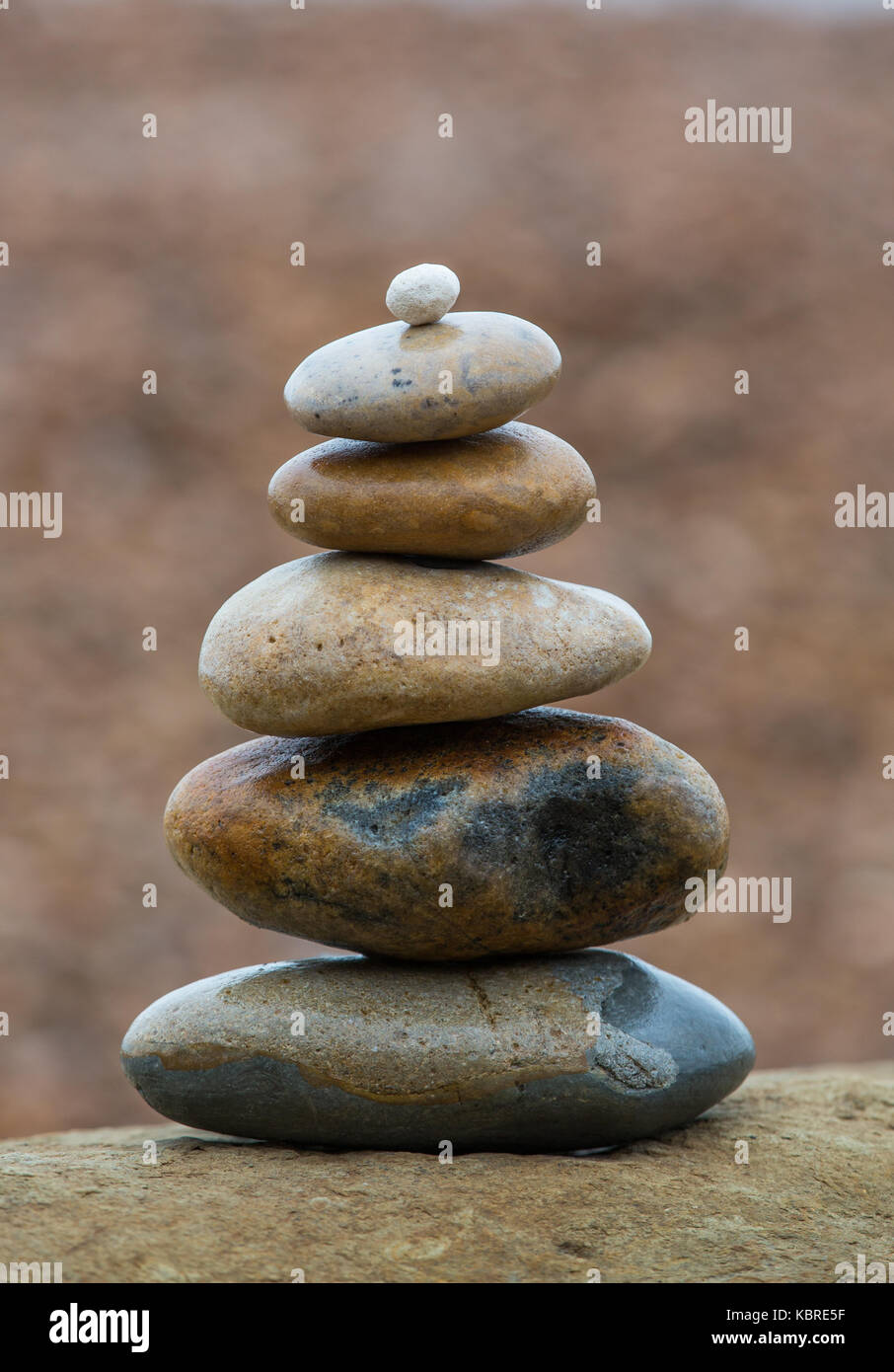 Balanced stones on beach Stock Photo - Alamy