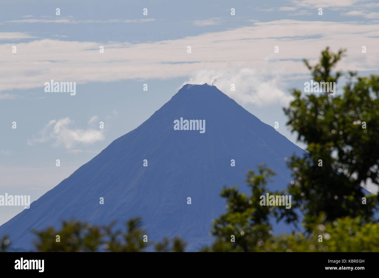 clear afternoon view of the Arenal volcano from across the lake Stock ...