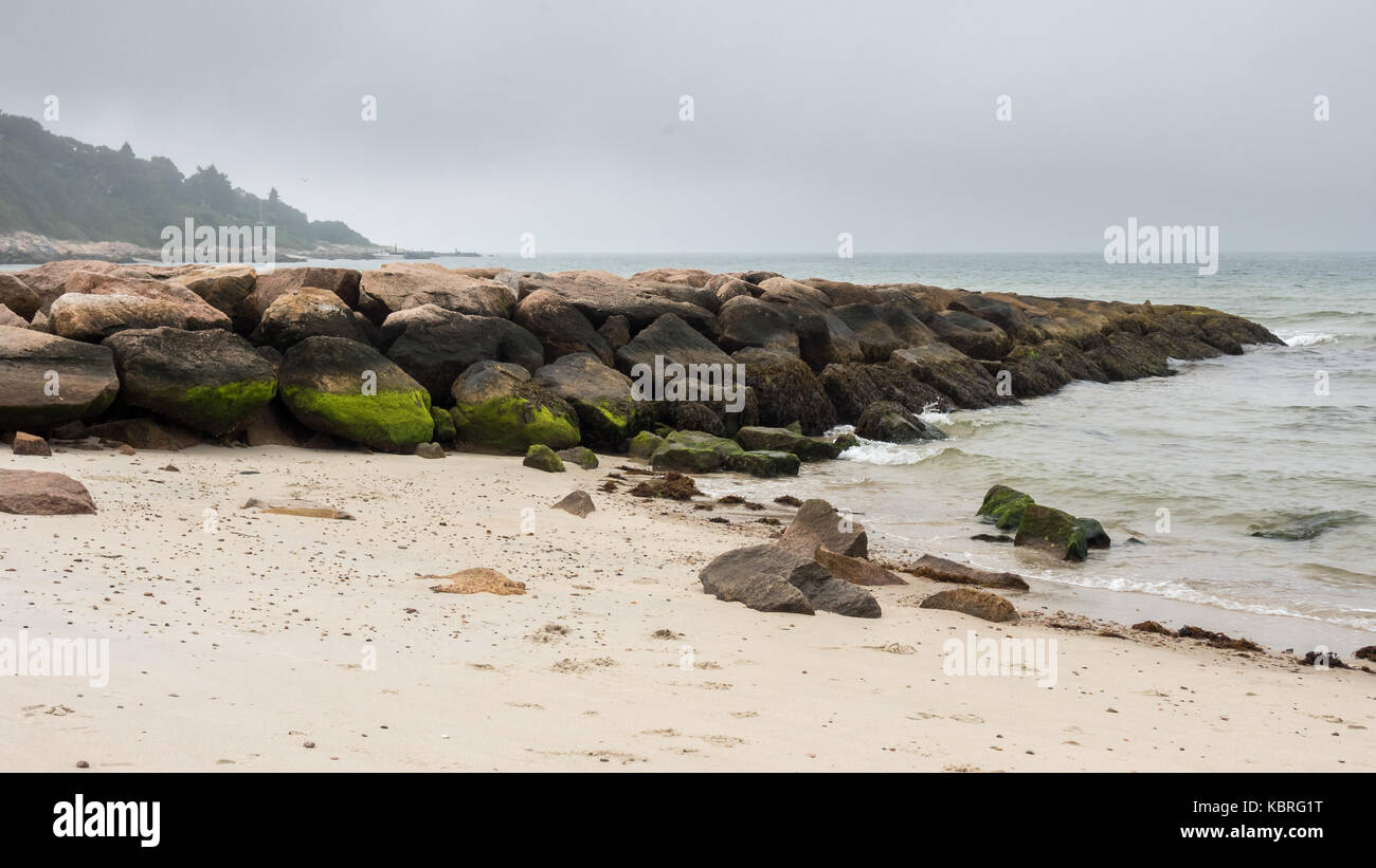 Fishing Pier Made of Rocks on the Beach Stock Photo - Alamy