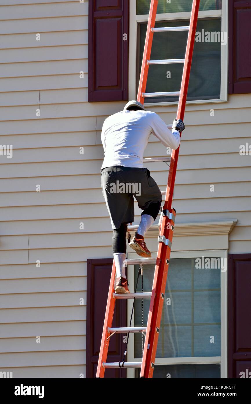 Construction worker climbing ladder hi-res stock photography and images ...