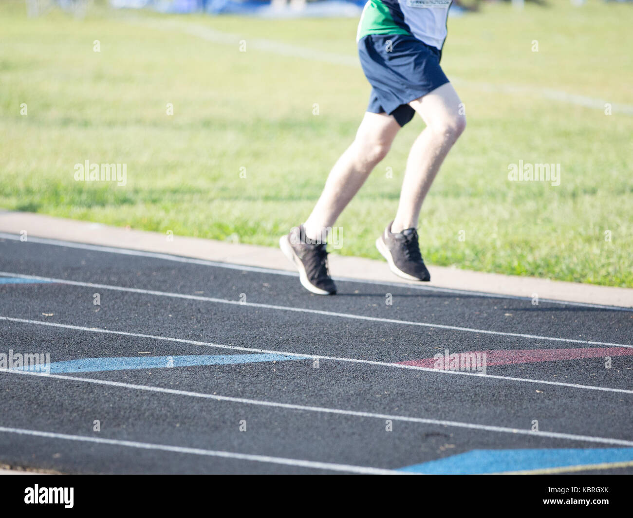 Black Running Surface with white curved lane, lane way Stock Photo - Alamy