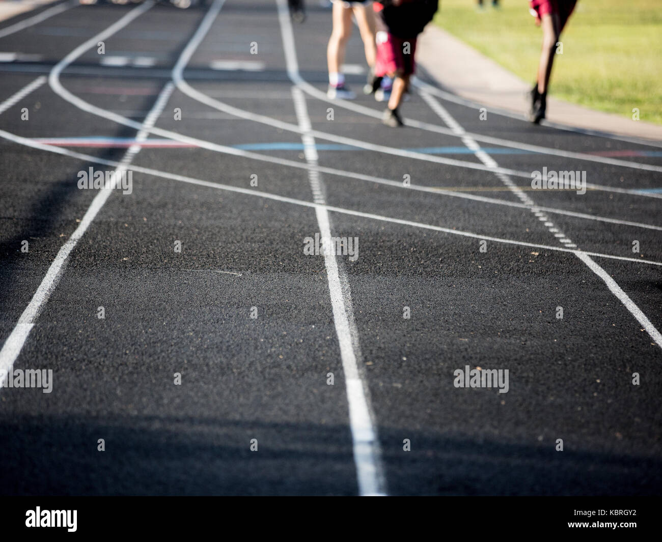 Black Running Surface with white curved lane, lane way Stock Photo - Alamy