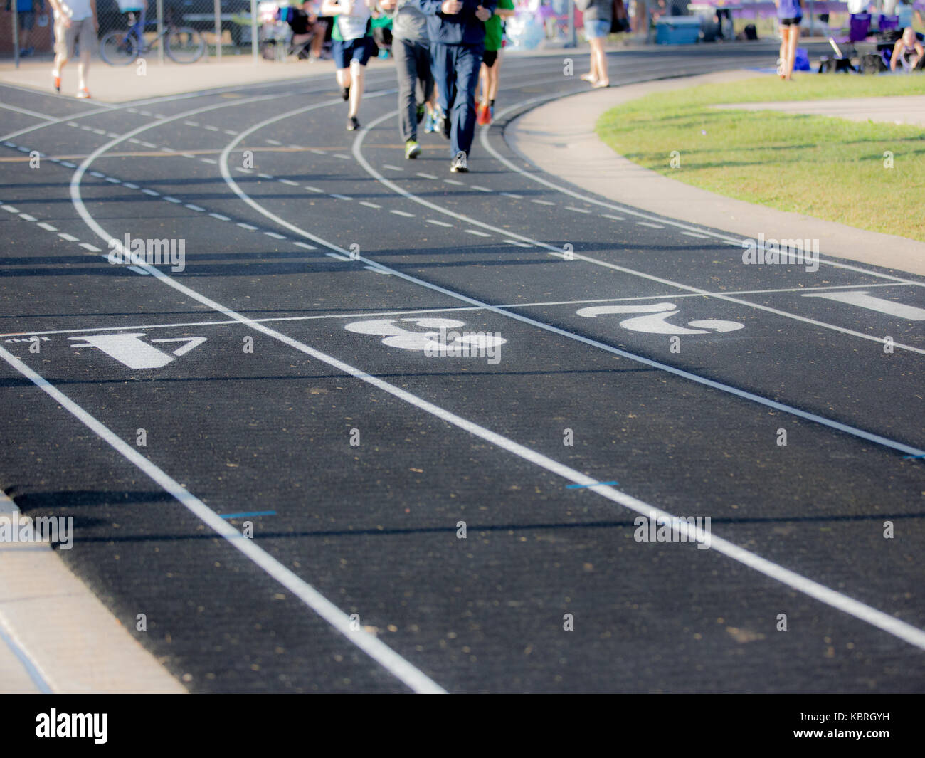Black Running Surface with white curved lane, lane way Stock Photo - Alamy