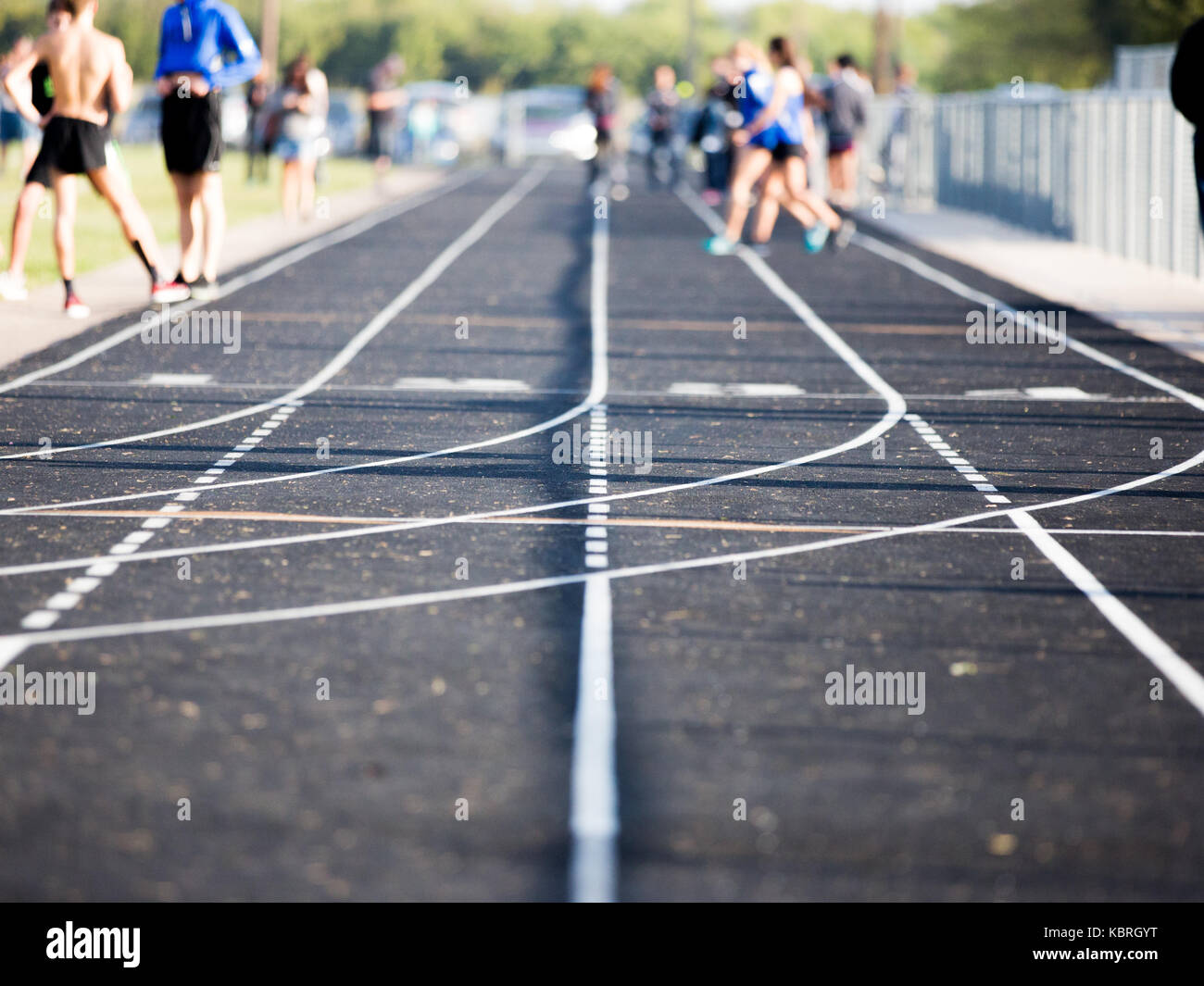 Black Running Surface with white curved lane, lane way Stock Photo - Alamy