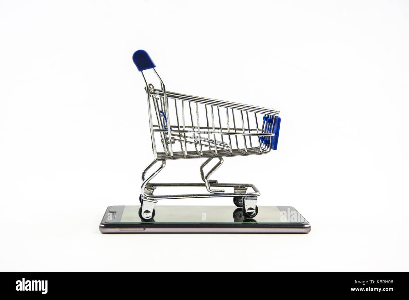 smart phone with shopping cart on white background , Means shopping ...