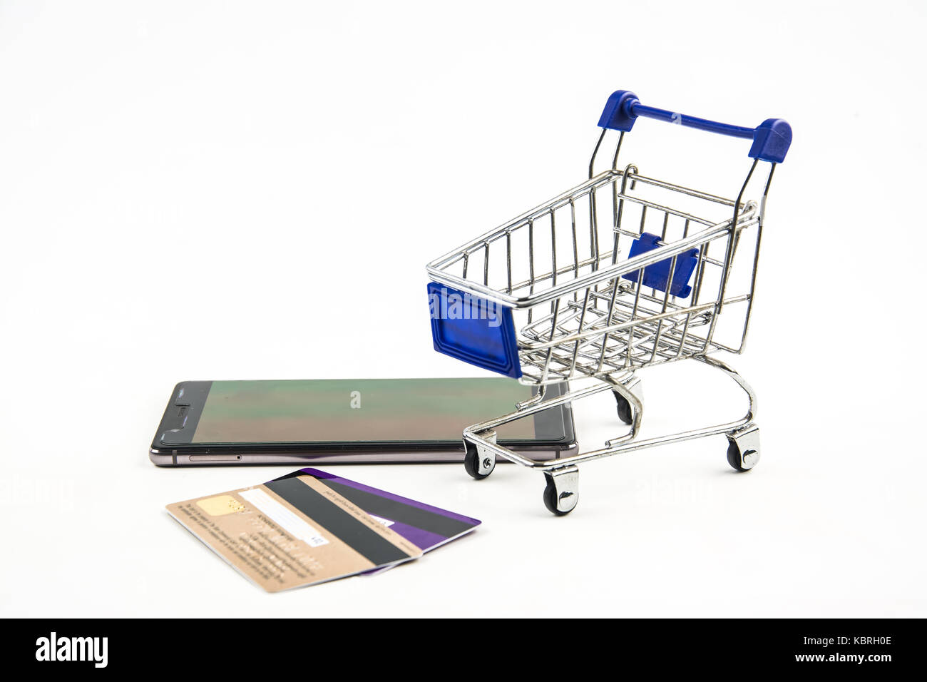 smart phone with shopping cart on white background , Means shopping ...