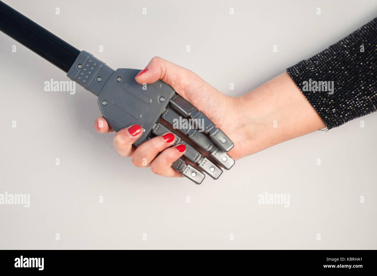 girl and robot handshake Stock Photo - Alamy