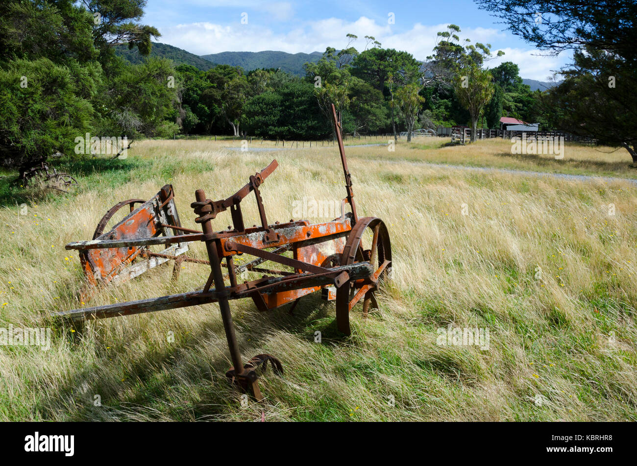 Overgrown old farm equipment hi-res stock photography and images - Alamy