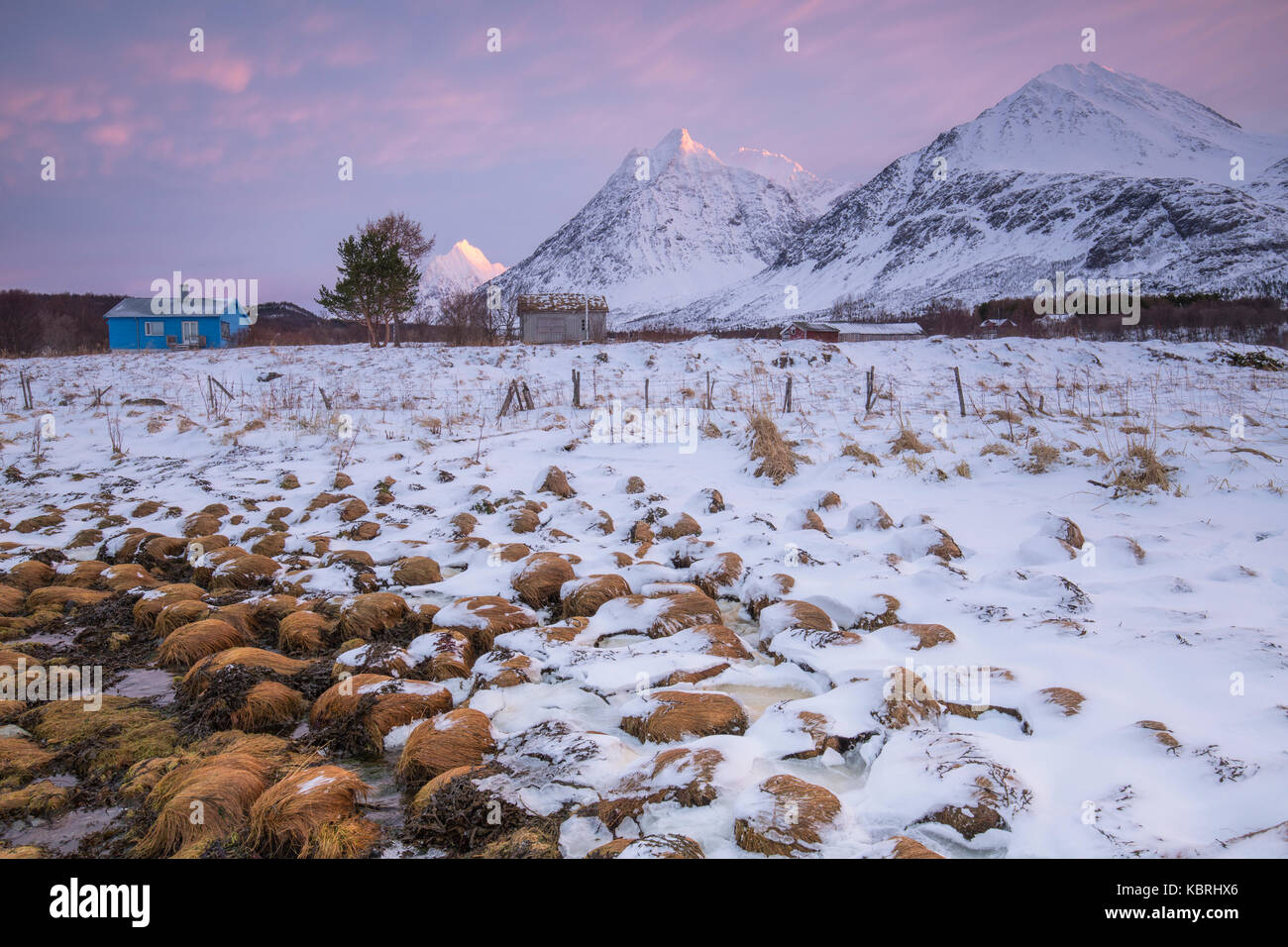 Sunrise over Piggtinden and Storvastinden from colorful houses of ...