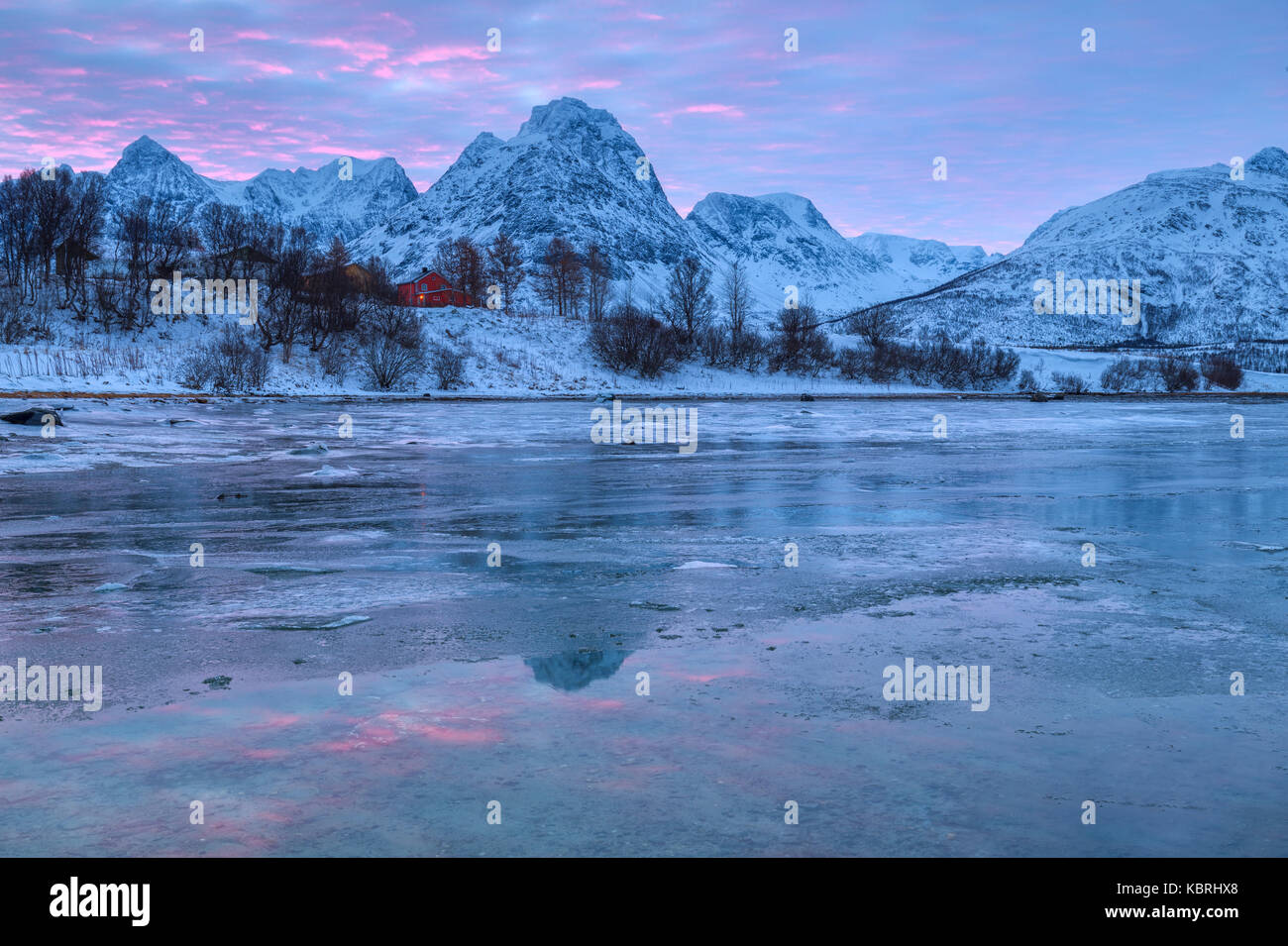 Sunrise near a frozen river that flows into Balsfjorden. Storsteinnes ...