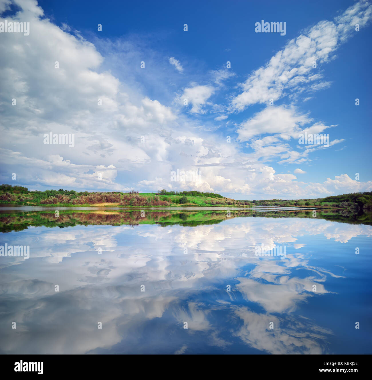 Beautiful lake river and spring green hills. Nature composition Stock ...
