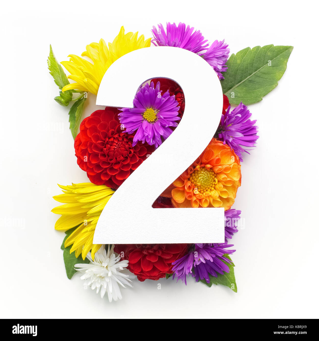 Layout with colorful flowers, leaves and number two. Flat lay. Top view ...