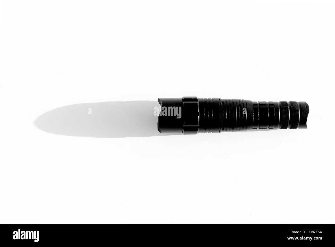 A flashlight and it's shadow in an isolated white background Stock ...