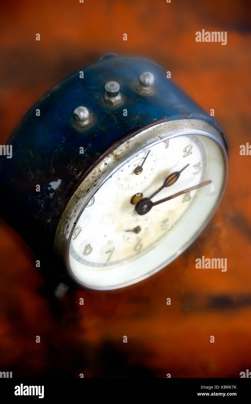vintage old and battered alarm clock Stock Photo - Alamy