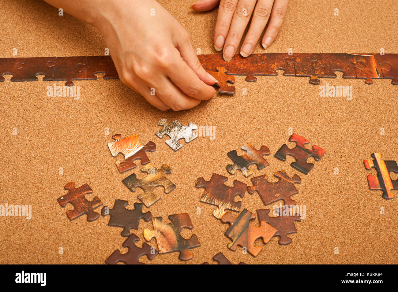 Hand jigsaw puzzle hi-res stock photography and images - Alamy