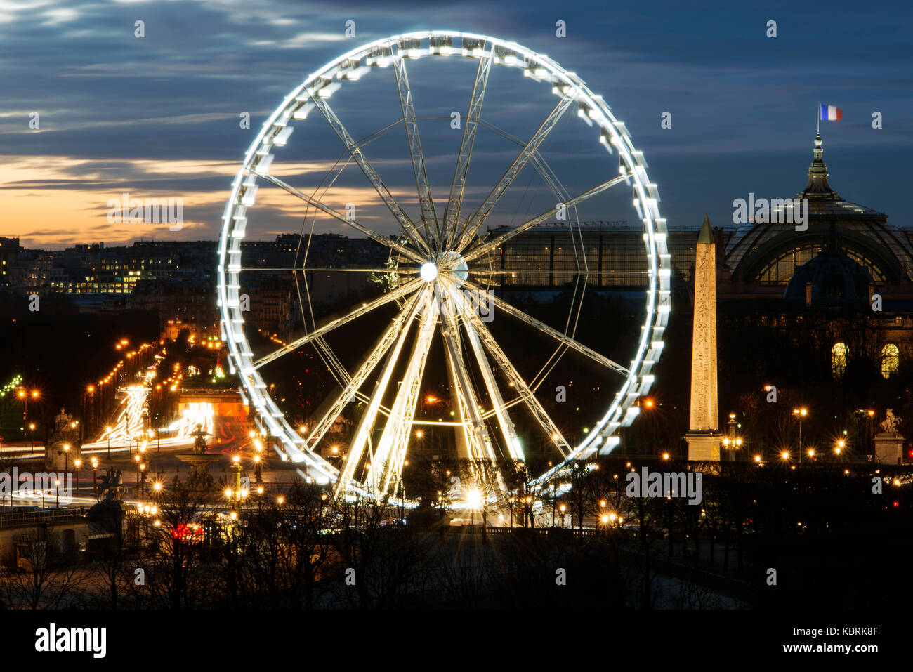 Ferris wheel and the city of Paris at night time Stock Photo - Alamy