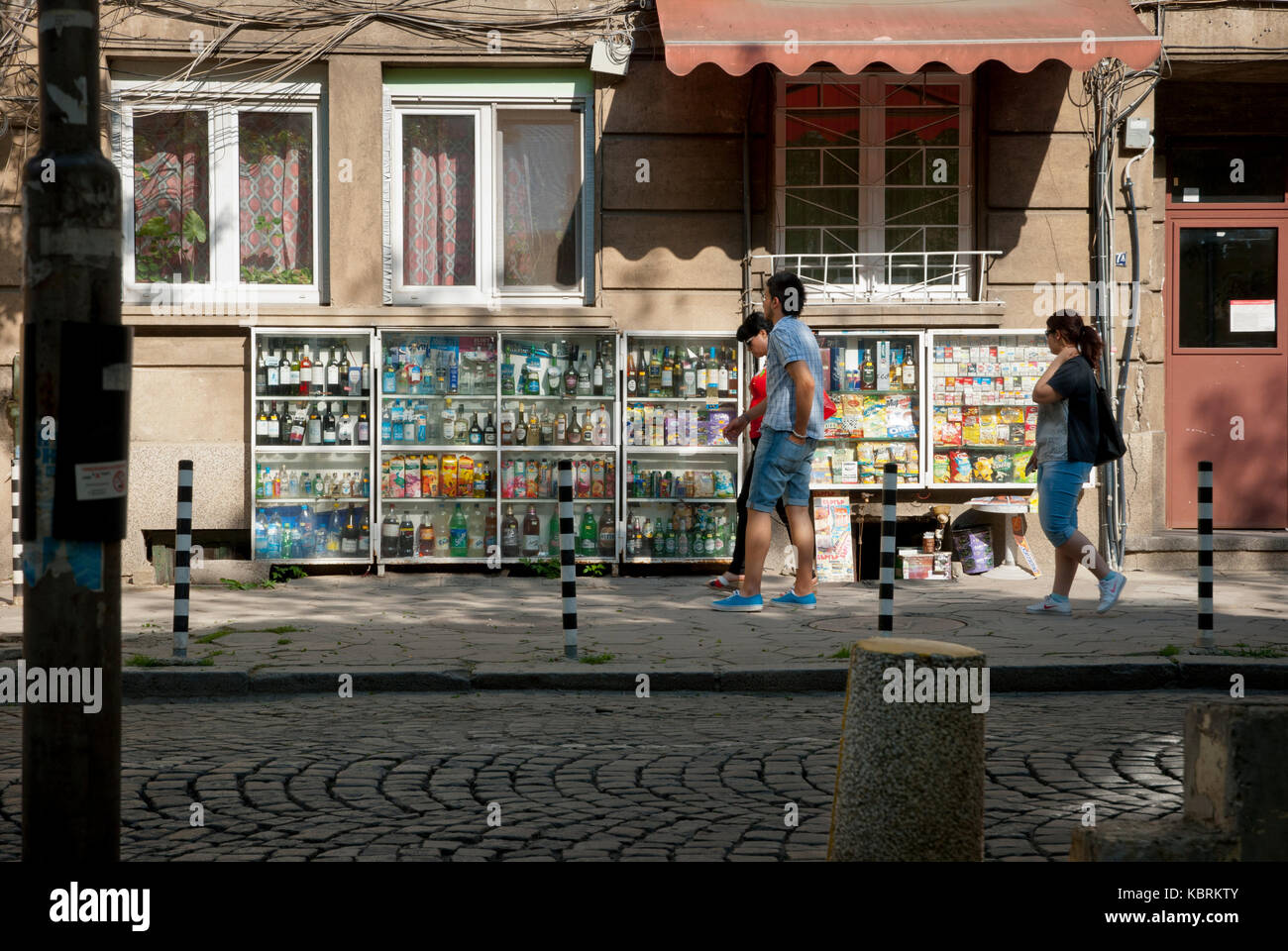 SOFIA, BULGARIA - APRIL 30: People buying groceries in small street ...
