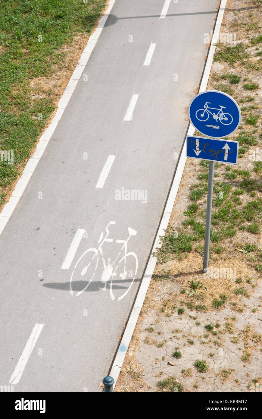Cycling path with sign Stock Photo - Alamy