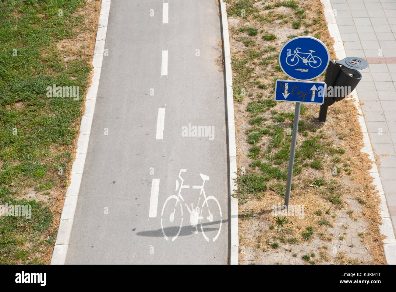 Cycling path with sign Stock Photo - Alamy