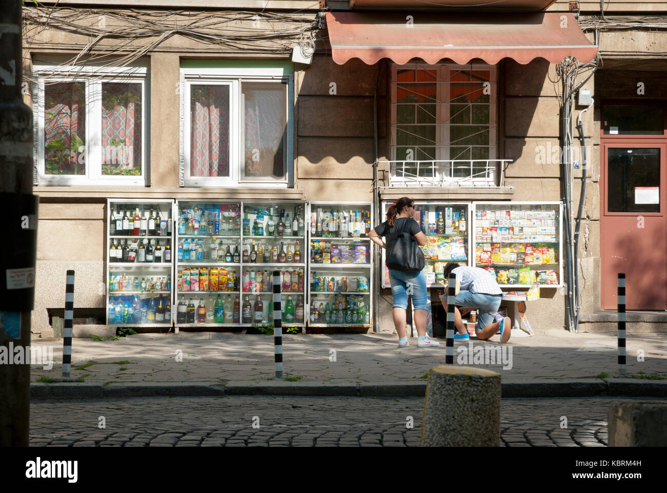 SOFIA, BULGARIA - APRIL 30: People buying groceries in small street ...