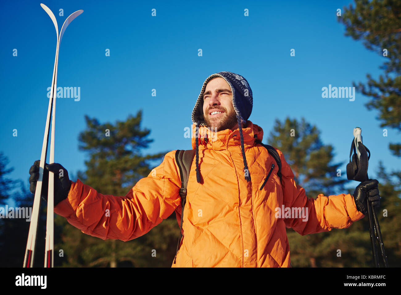 Young happy man skiing hi-res stock photography and images - Alamy