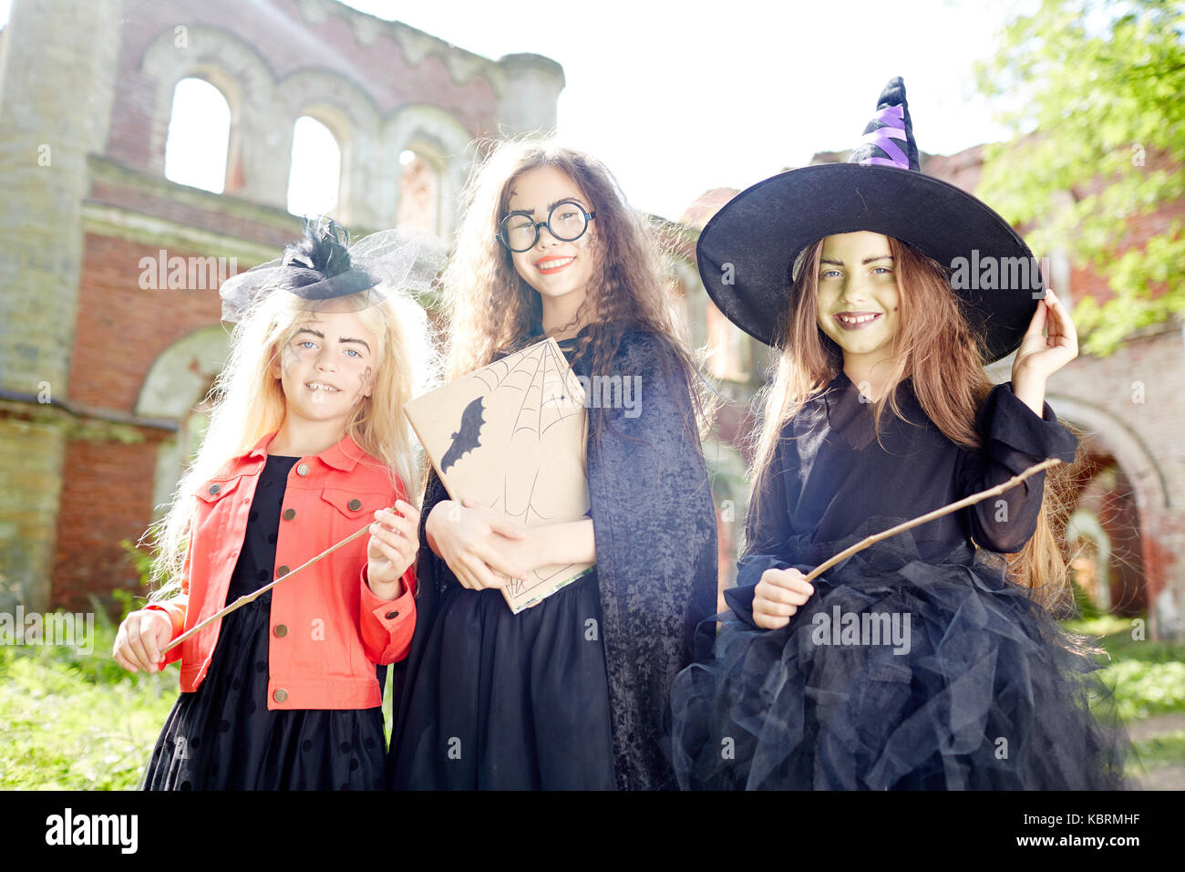 Three cute witches Stock Photo - Alamy