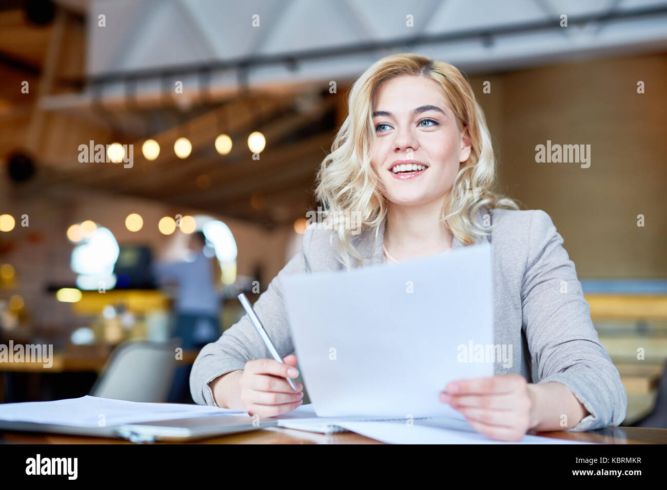 Woman with paperwork Stock Photo - Alamy