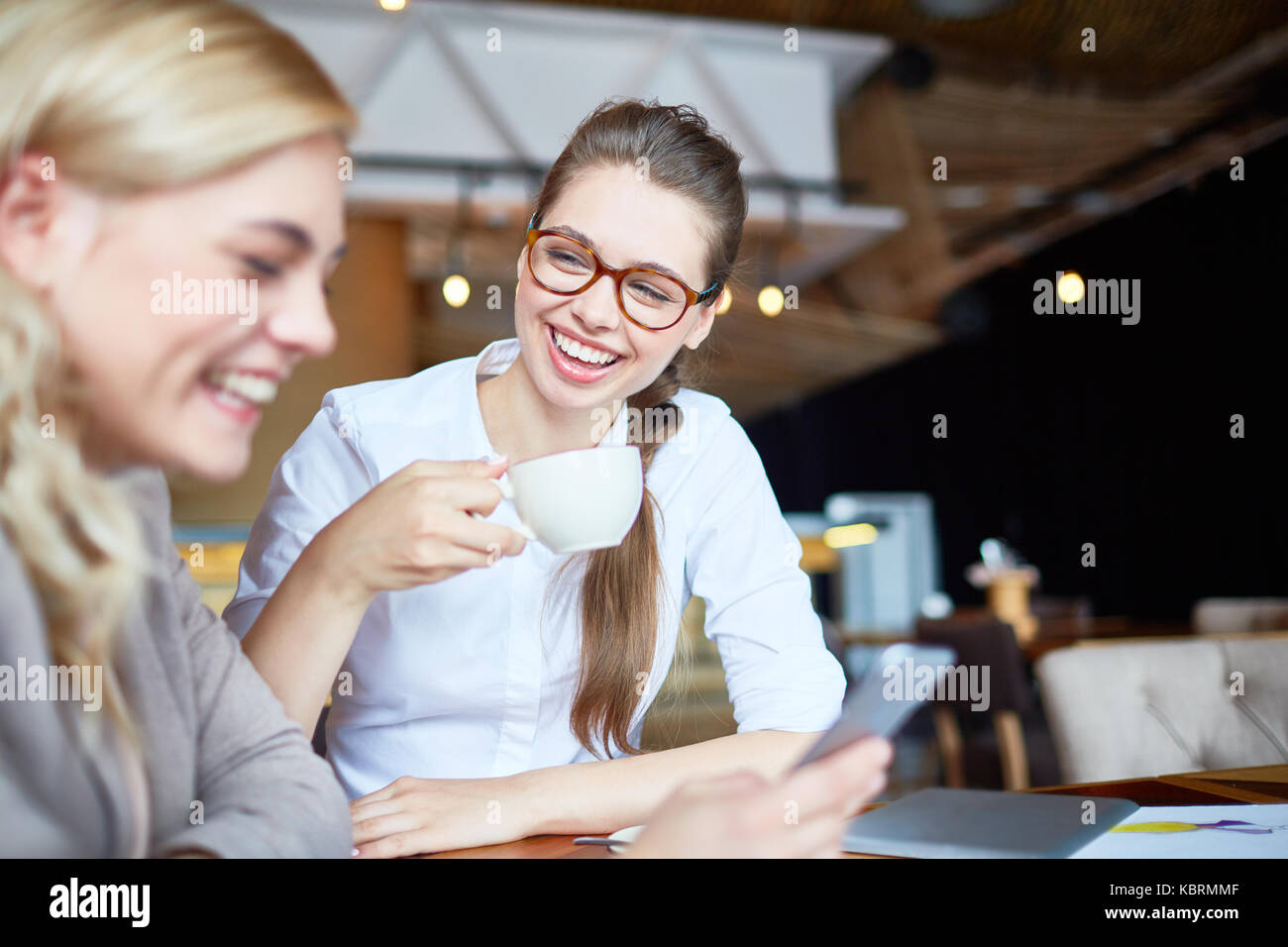 Girls having tea Stock Photo - Alamy