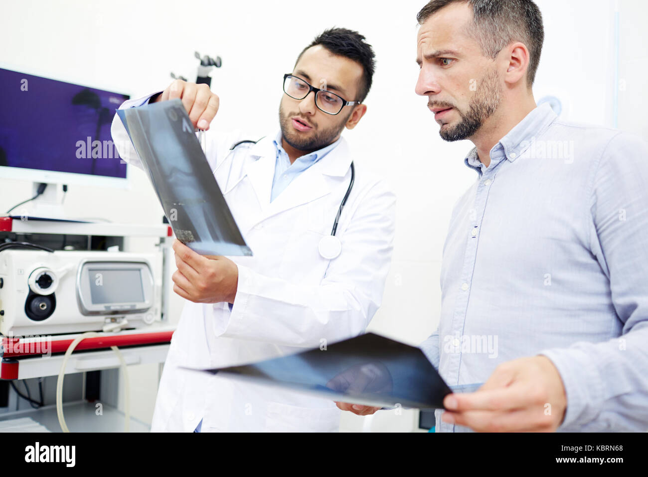 Discussing Diagnosis with Doctor Stock Photo - Alamy