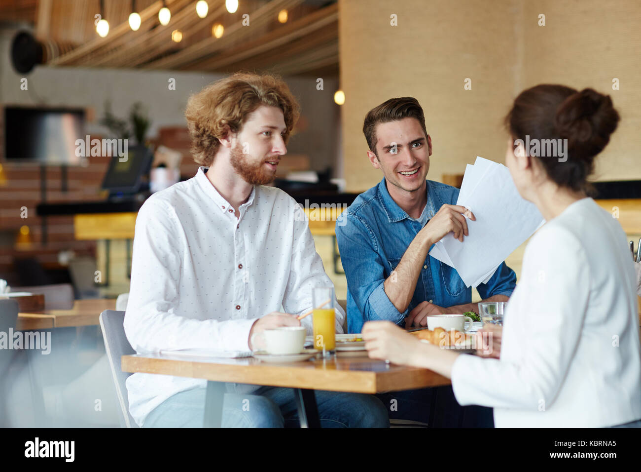 Discussion by lunch Stock Photo - Alamy
